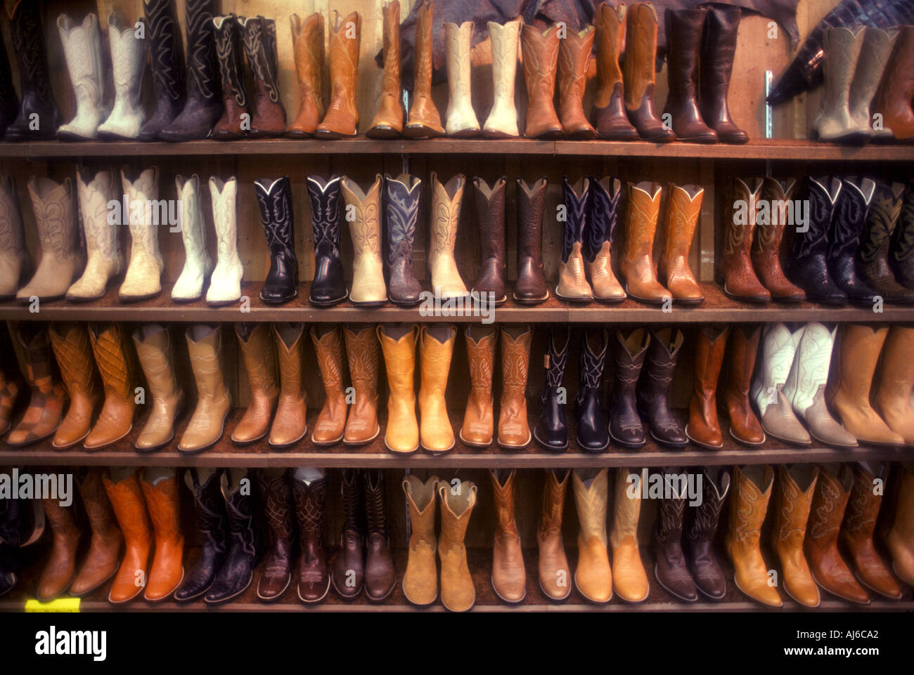 Cowboy boots on display in store Stock Photo - Alamy