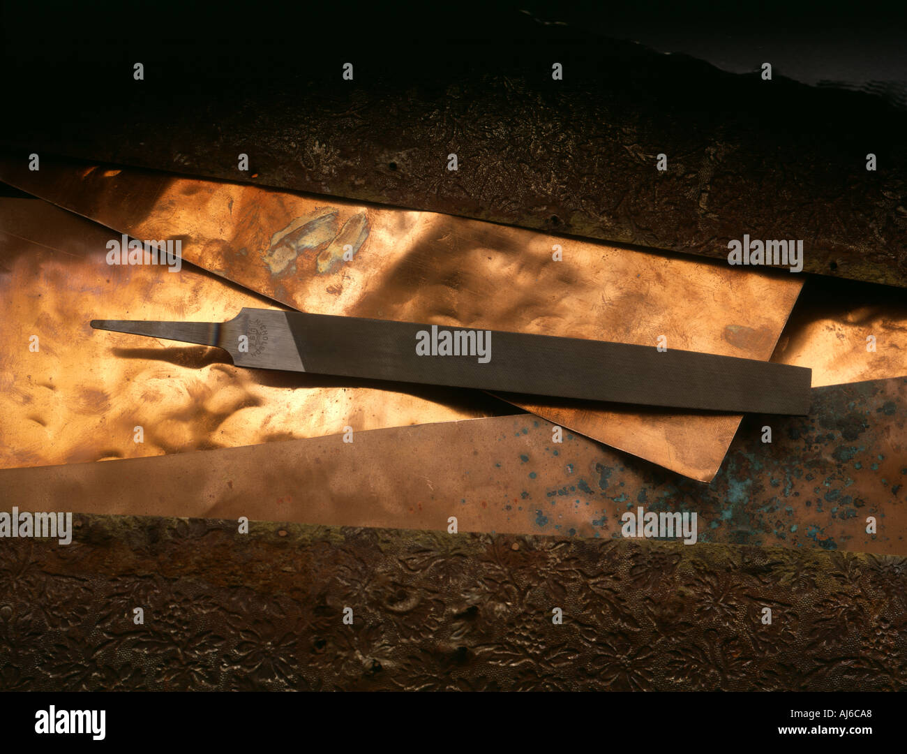 Metal file on copper metal Stock Photo - Alamy