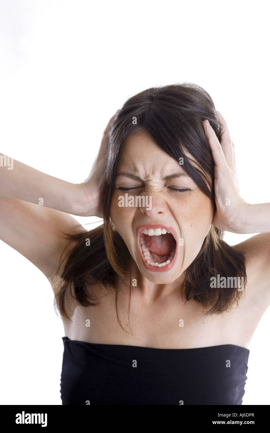 young woman holding her head and scream Stock Photo - Alamy