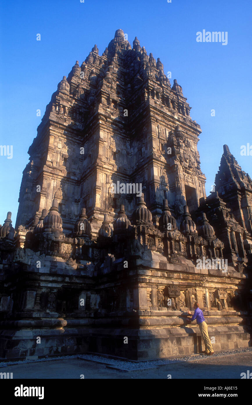 Man examining stone carvings at the Prambanan Temple Complex in Central ...