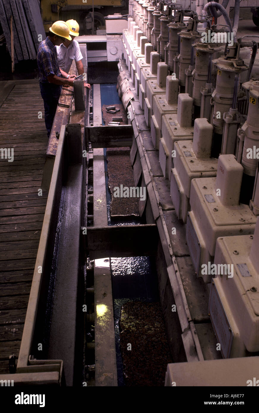 Workers at granite or stone polishing machine Stock Photo - Alamy
