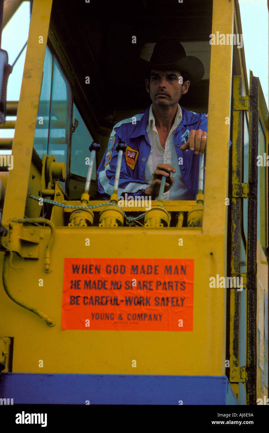 Crane operator with spare parts safety sign Stock Photo - Alamy
