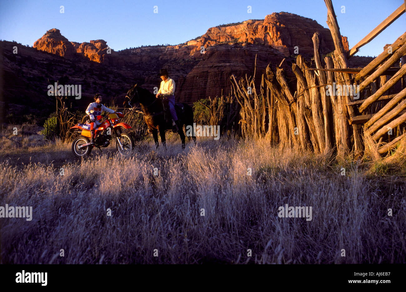 Motorcycle rider and cowboy on horse in Arizona Stock Photo - Alamy