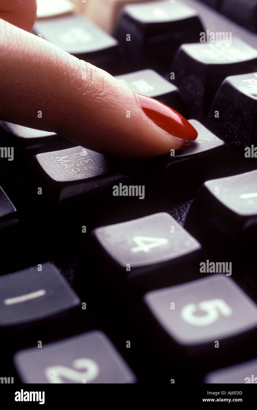 Female finger on computer keyboard Stock Photo - Alamy