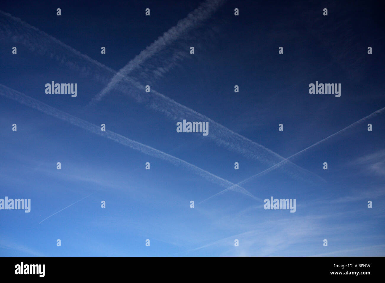 Deep autumn sky with contrails Stock Photo - Alamy
