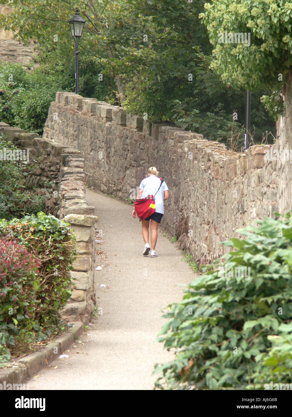 Postwoman delivering mail Stock Photo - Alamy