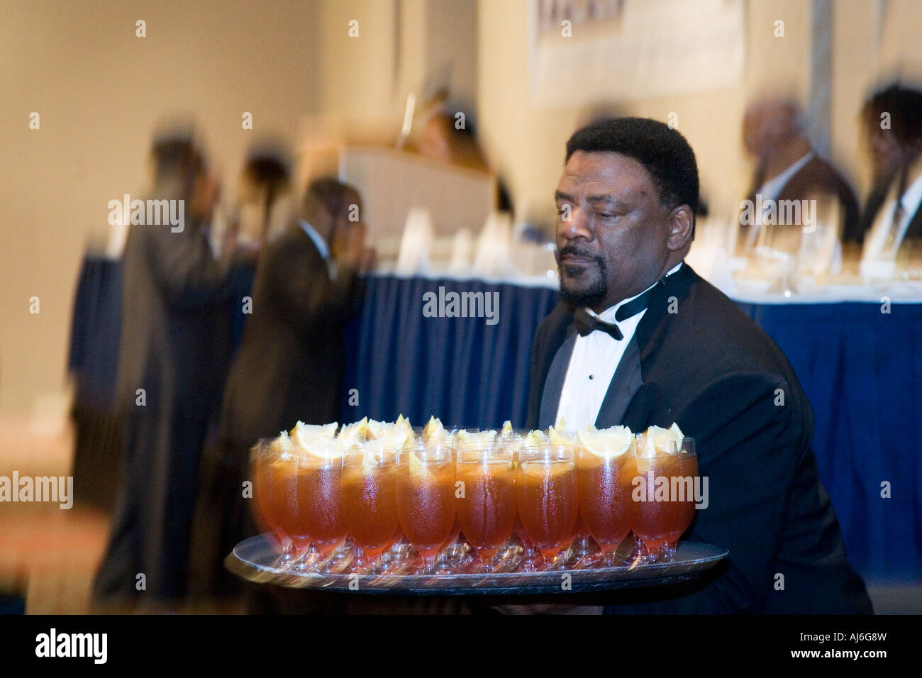 Dearborn Michigan A banquet waiter serves iced tea at a luncheon at the ...