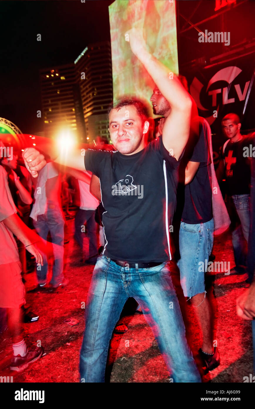 Israel, Tel Aviv A young man dancing at a beach party Stock Photo - Alamy