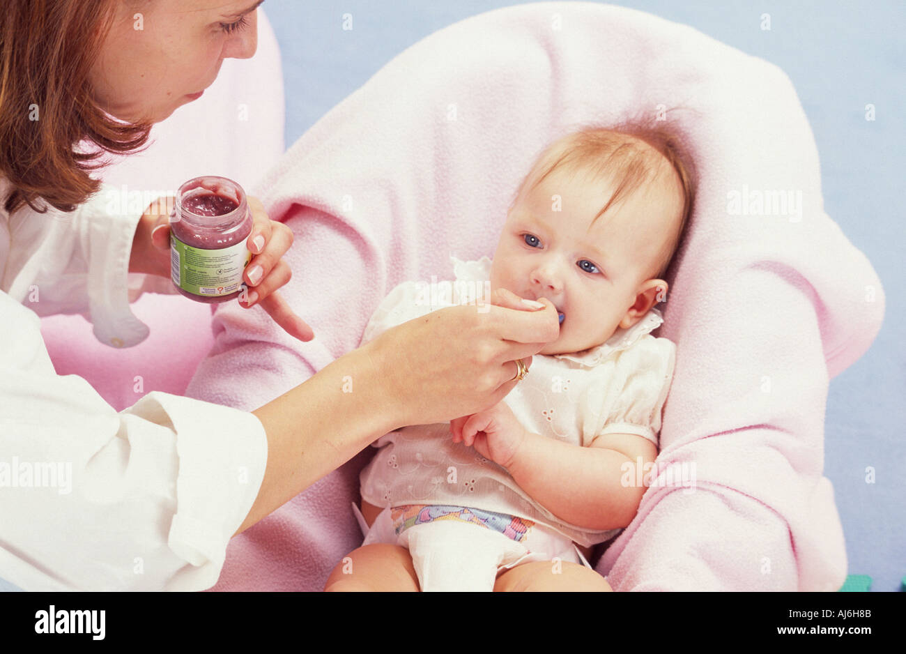 Mother nursing her baby Stock Photo - Alamy