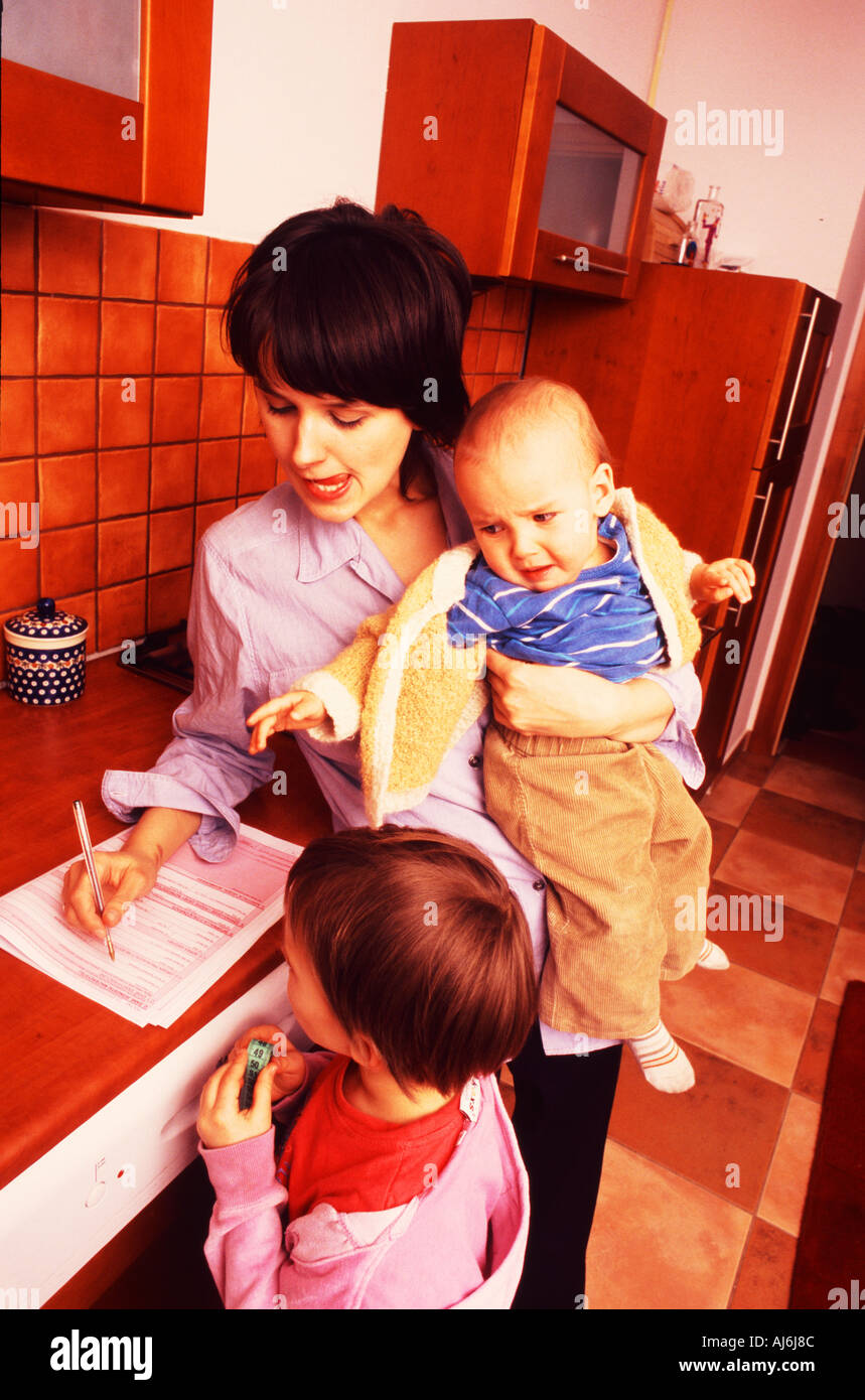Women witch children in the kitchen Stock Photo - Alamy