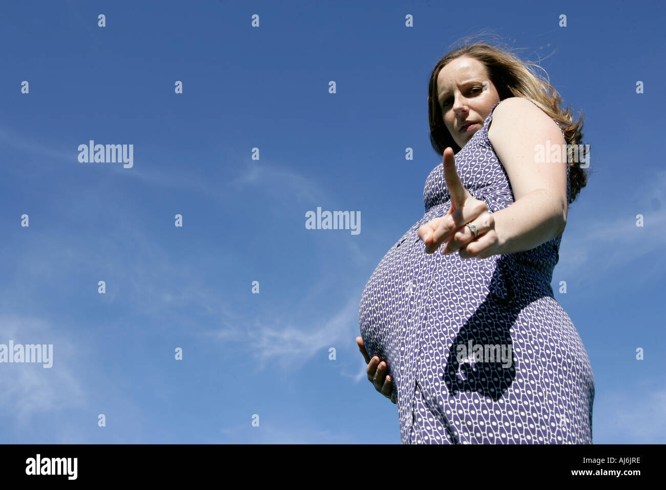 Pregnant woman telling off her child Stock Photo - Alamy