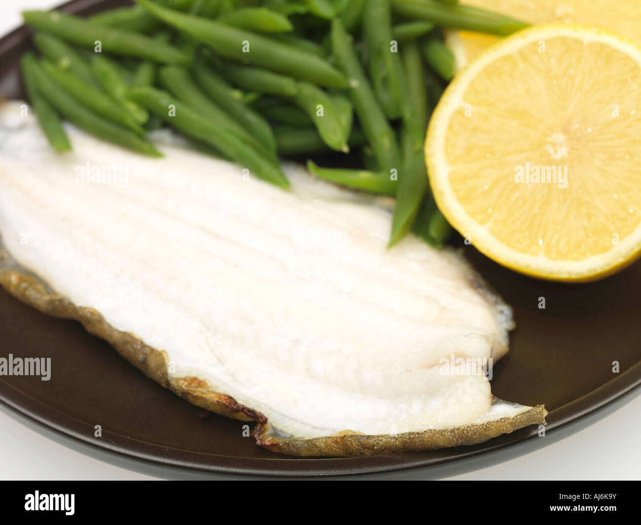 Gently Poached Fresh Healthy Fillet Of Lemon Sole Flat Fish With Green ...