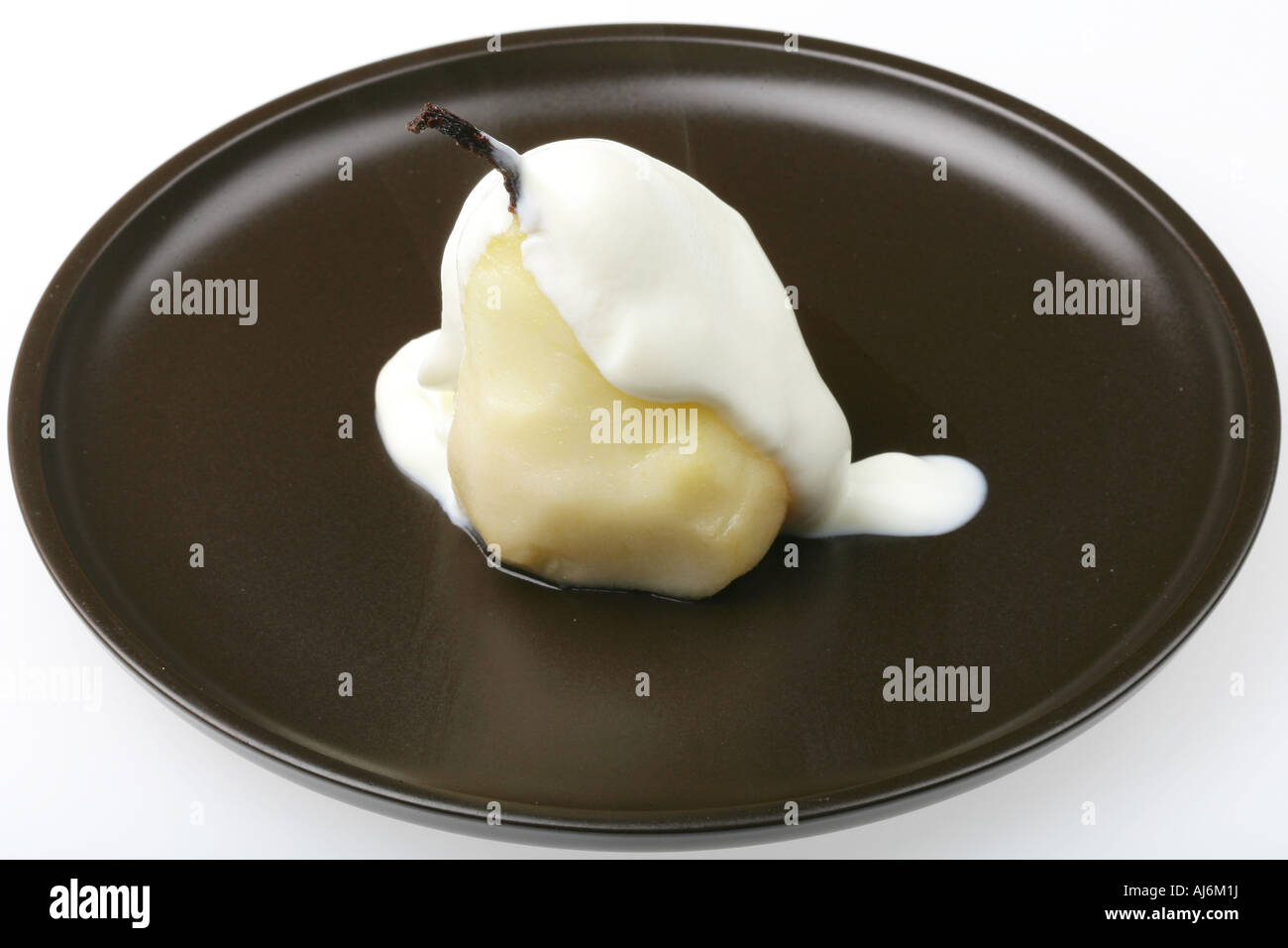 Poached Pear with Natural Yoghurt Stock Photo - Alamy