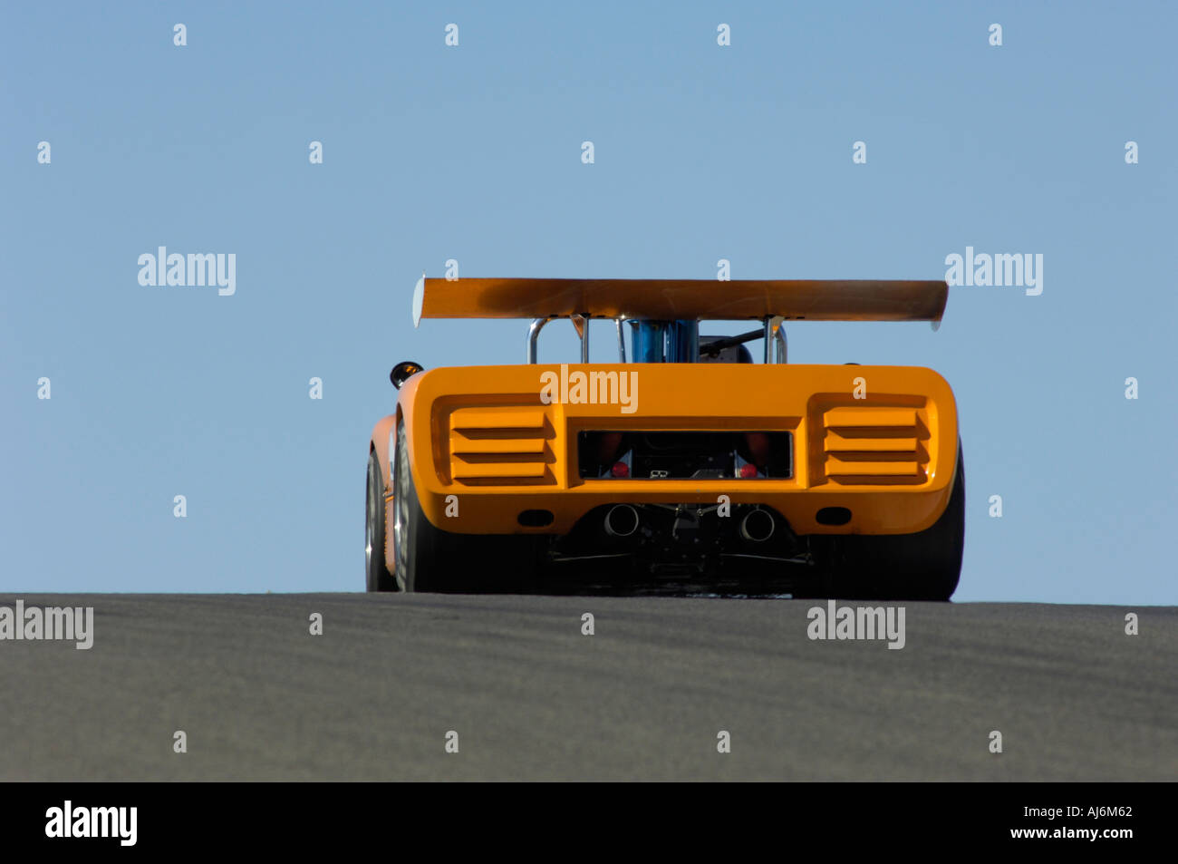 Tom Malloy races a 1971 McLaren M8E at the 32nd Monterey Historic ...