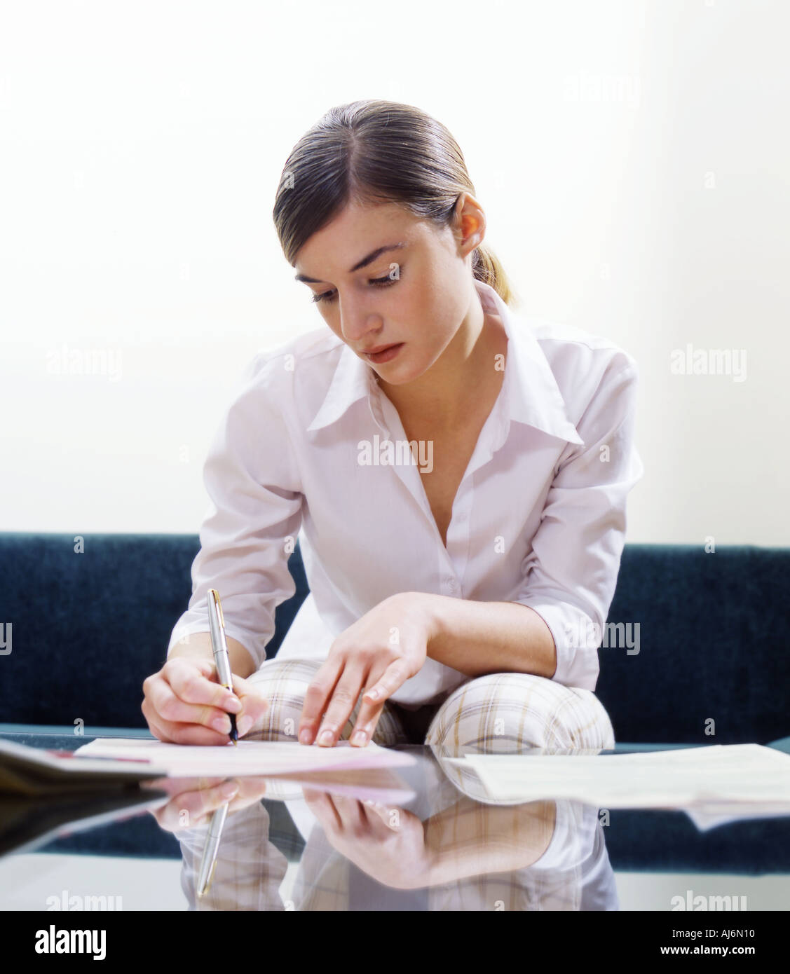 One woman writing paper light hi-res stock photography and images - Alamy