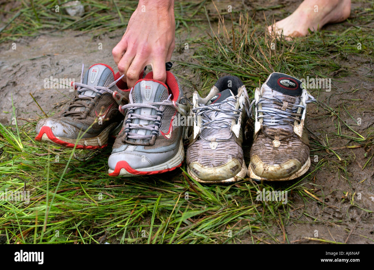 Wet and muddy competitors trainers in the World Bog Snorkelling ...