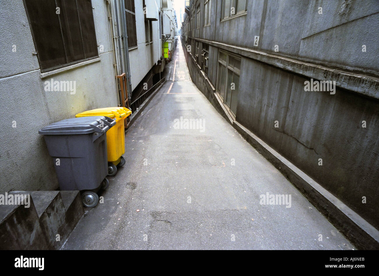 Trash cans in a deserted alley in central Tokyo Stock Photo - Alamy