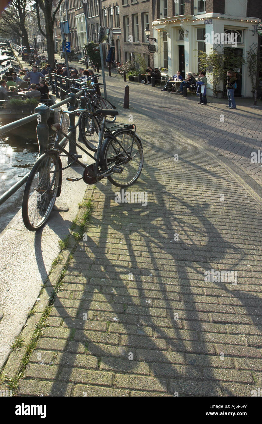 Shadows of parked bicycles on the pavement in Amsterdam Stock Photo - Alamy