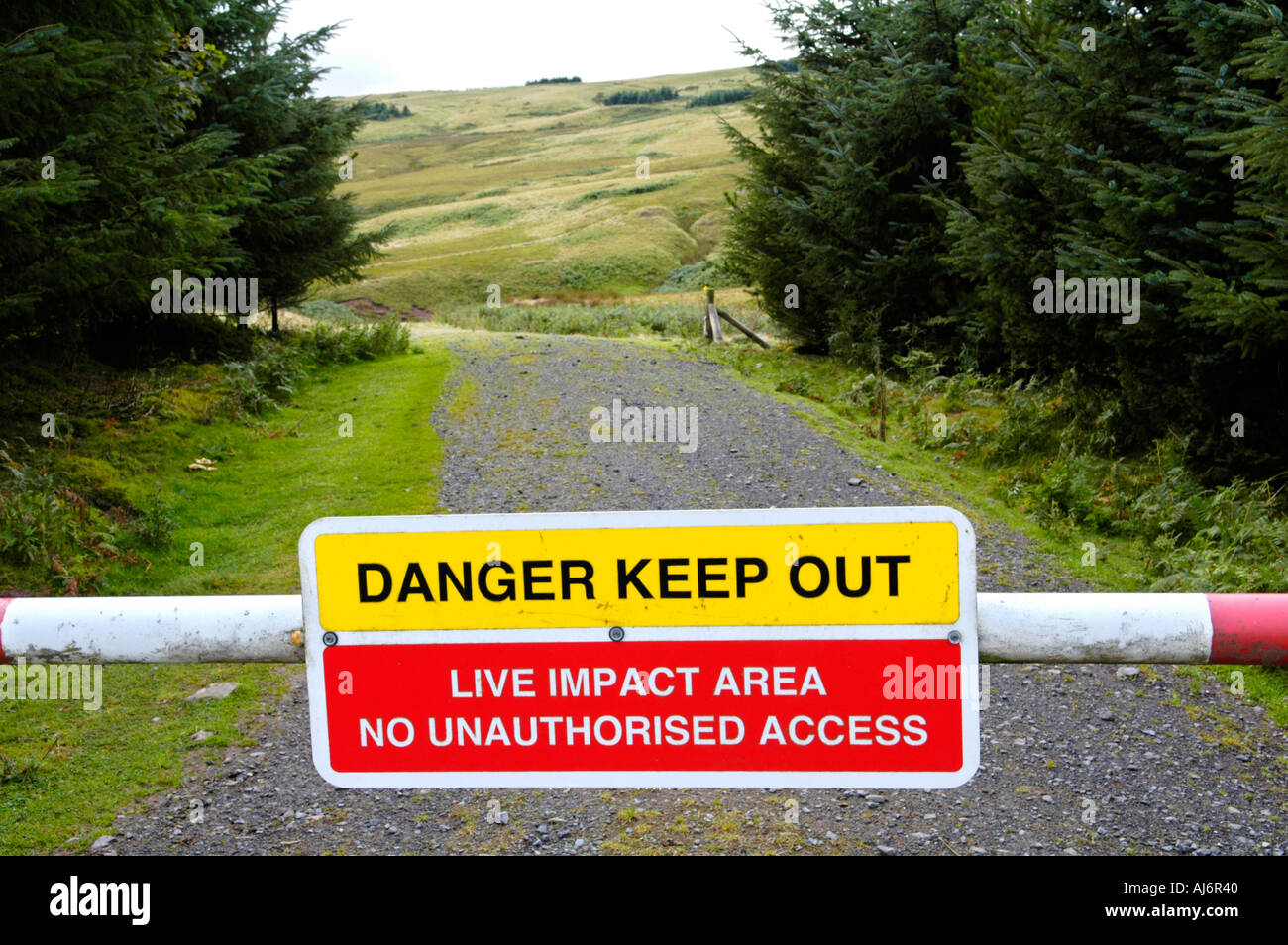 DANGER KEEP OUT warning notice at the entrance to a MILITARY FIRING ...