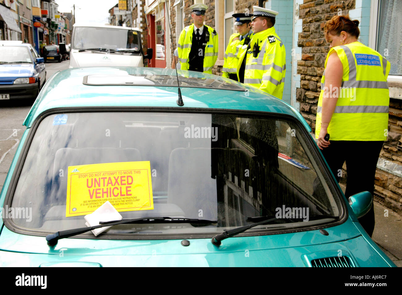 DVLA official and Police Officers seize an untaxed car parked on the ...