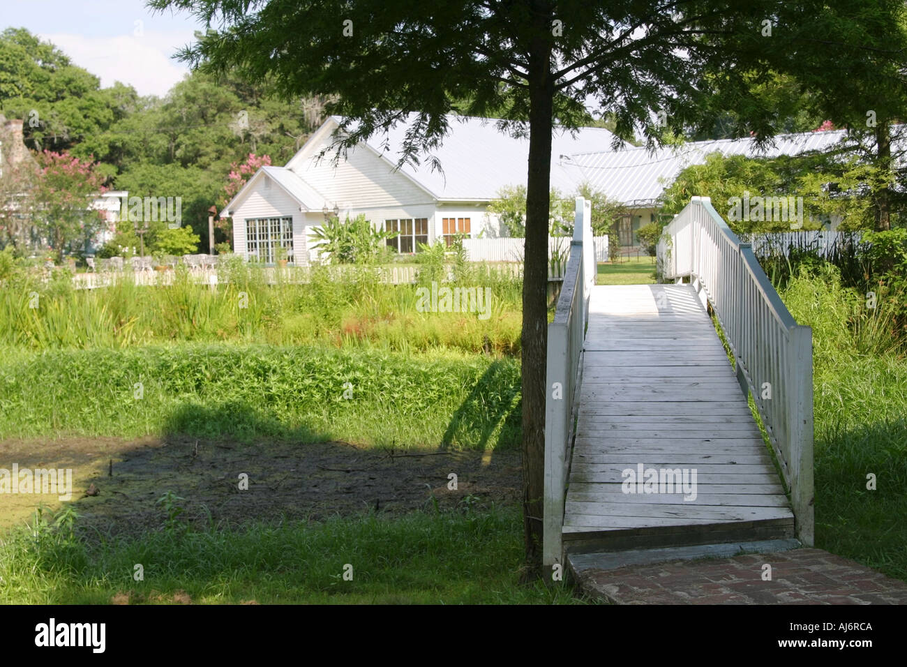 Small bridge over pond Stock Photo - Alamy