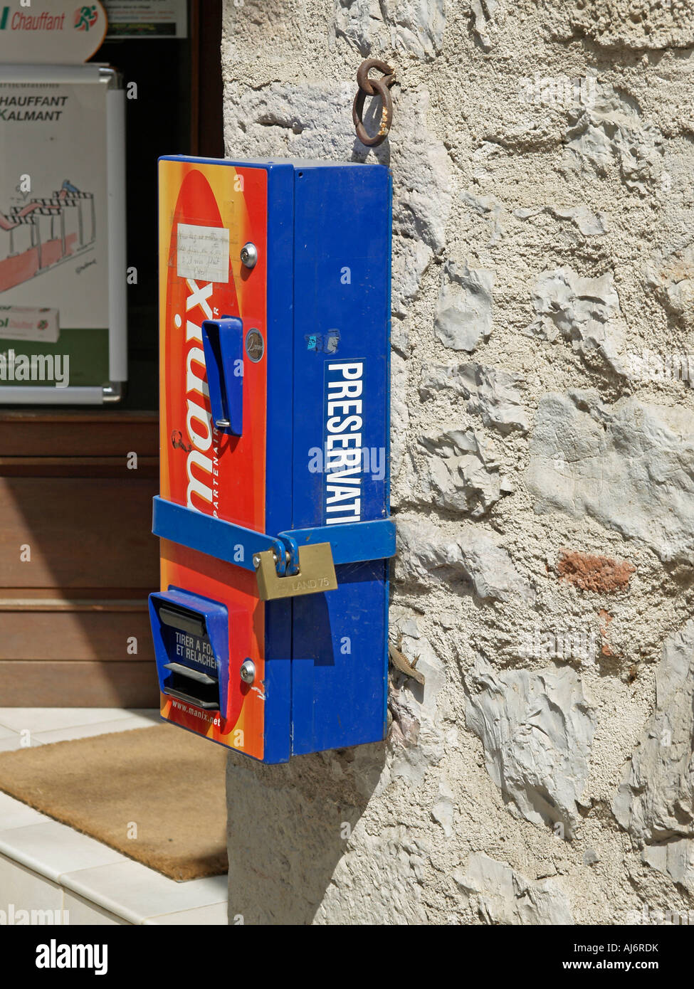 delivery automat for condoms on house wall Stock Photo - Alamy