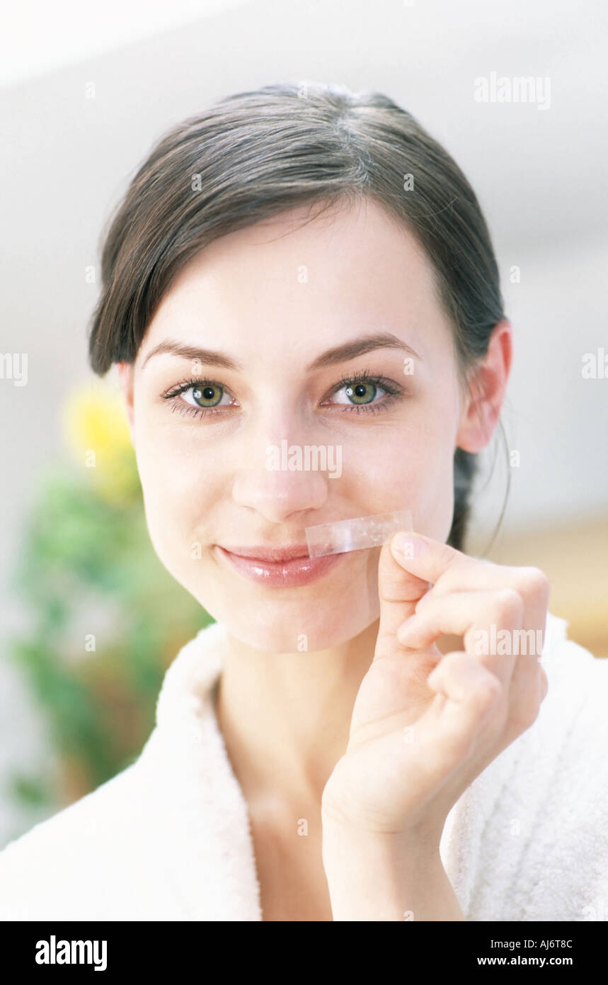 Woman holding small plaster Stock Photo - Alamy