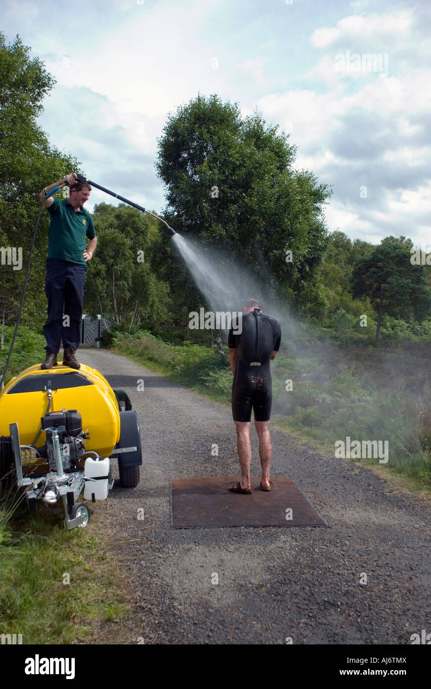 Getting a shower after bog-snorkeling, using a Power Washer Stock Photo ...