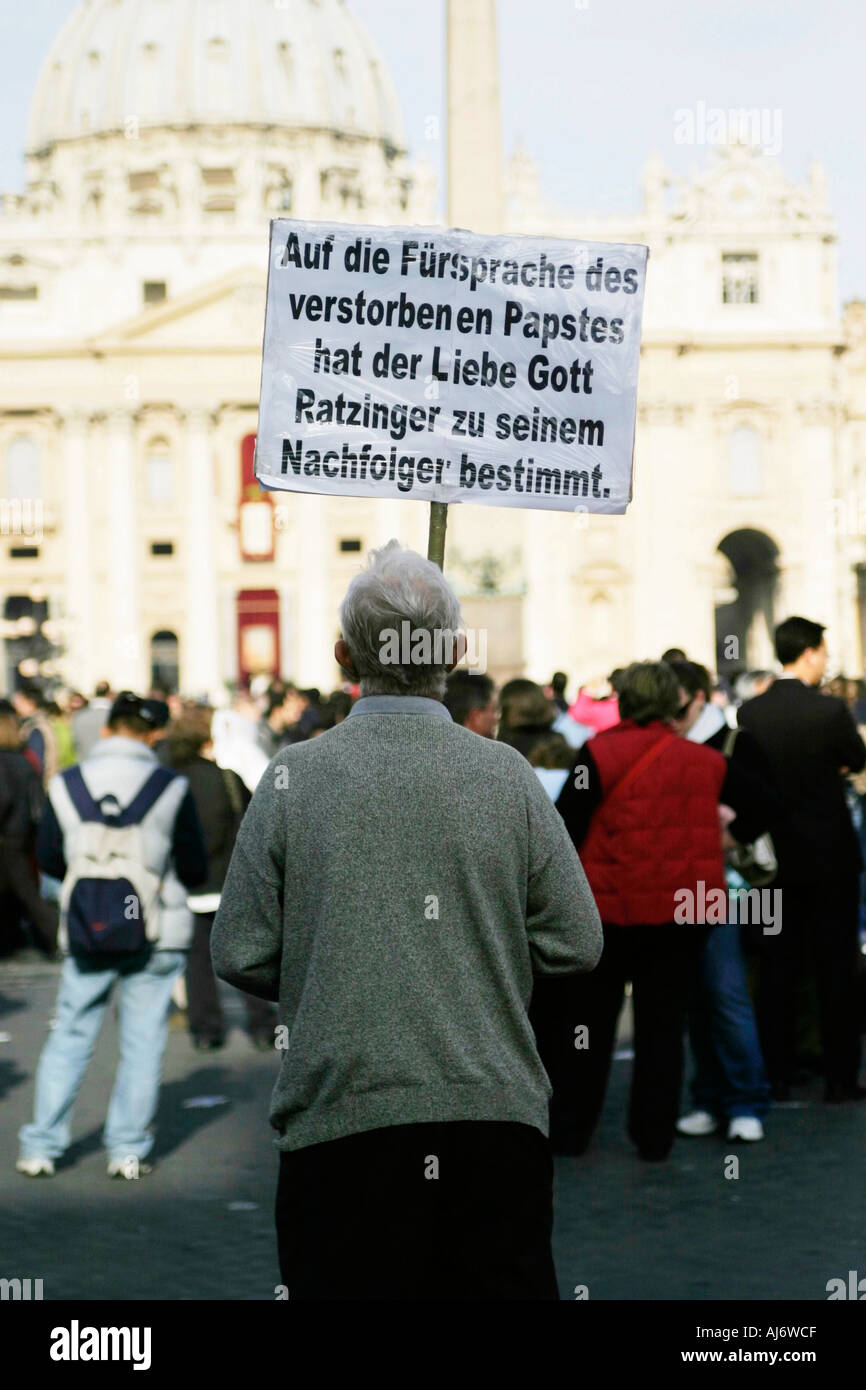 Elderly man holding sign Vatican Italy Stock Photo - Alamy