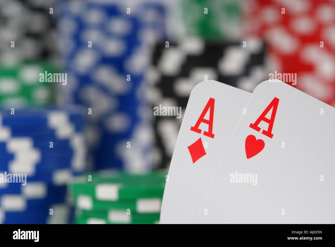 stacks of poker chips and two aces Stock Photo - Alamy