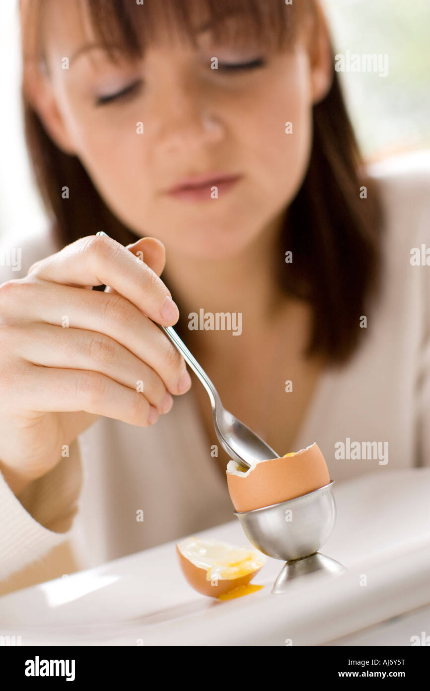 Woman eating boiled egg Stock Photo - Alamy