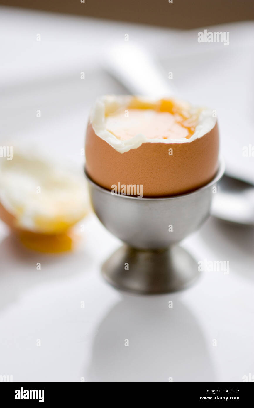 Opened Boiled egg in egg cup Stock Photo - Alamy