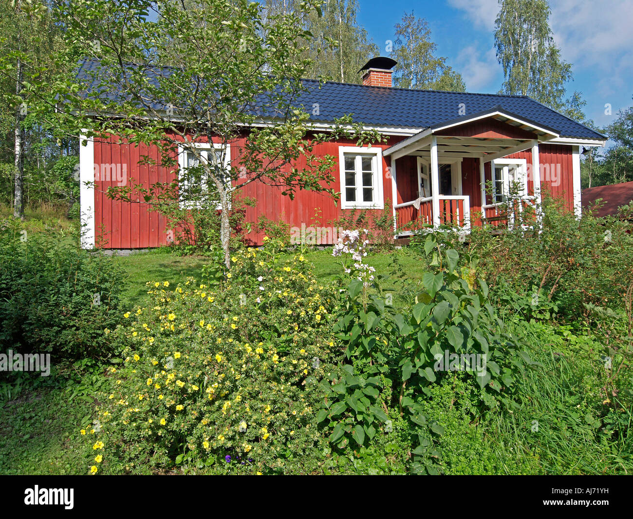 typical scandinavian red wooden timber house in Finland Stock Photo - Alamy