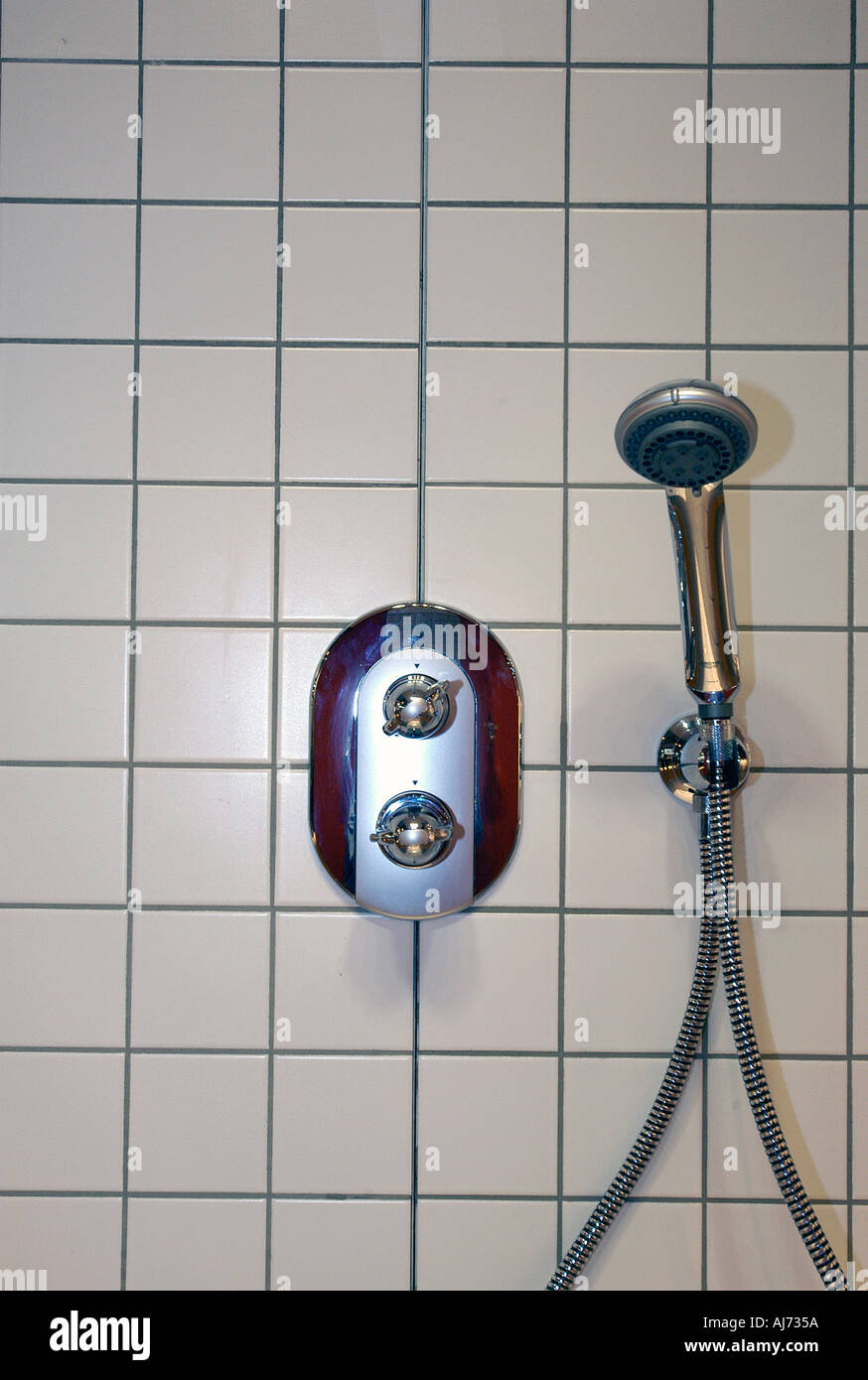 Shower controls on bathroom wall Stock Photo - Alamy