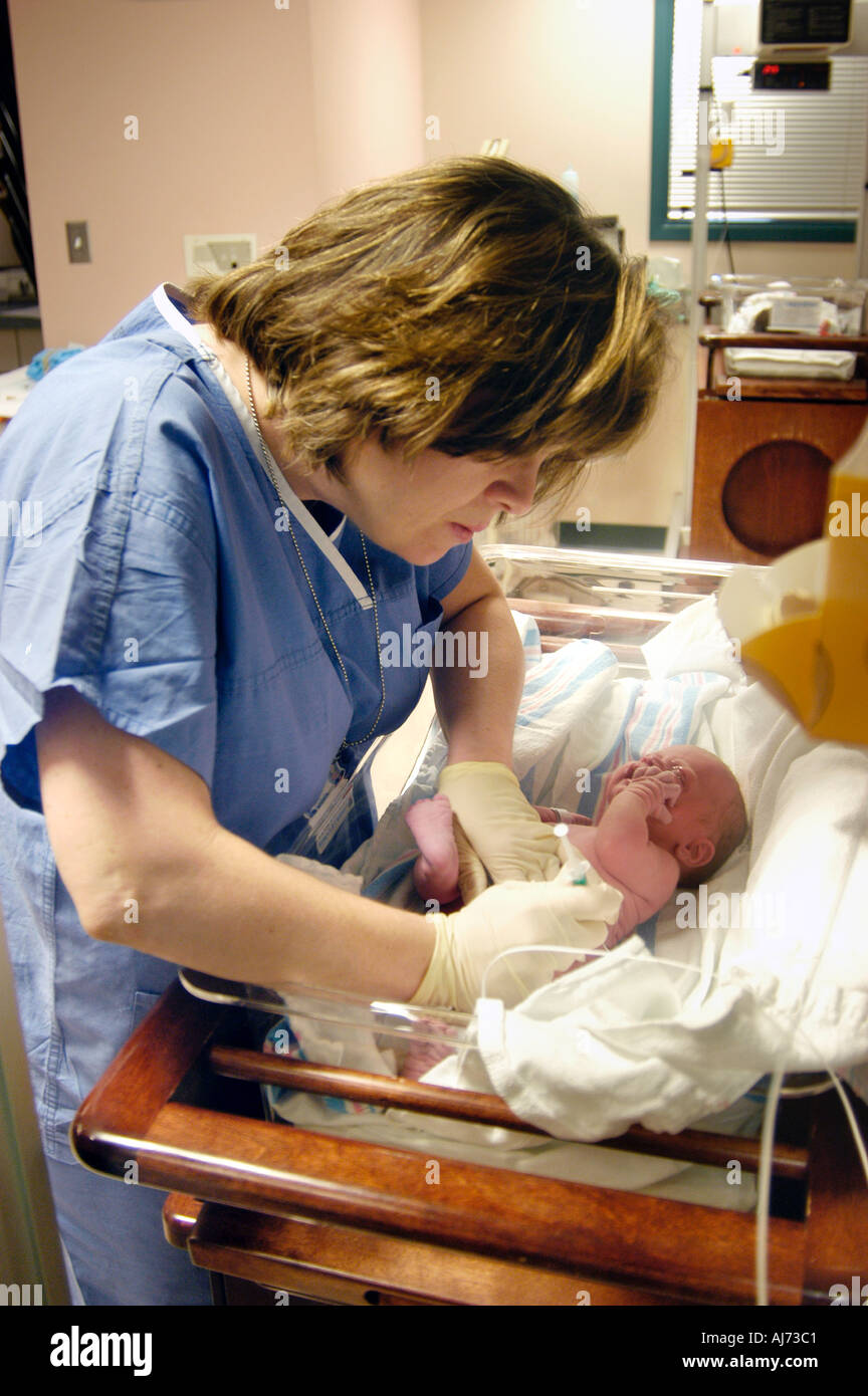 Female Pediatrician Checks New Born Baby after Birth in a hospital ...