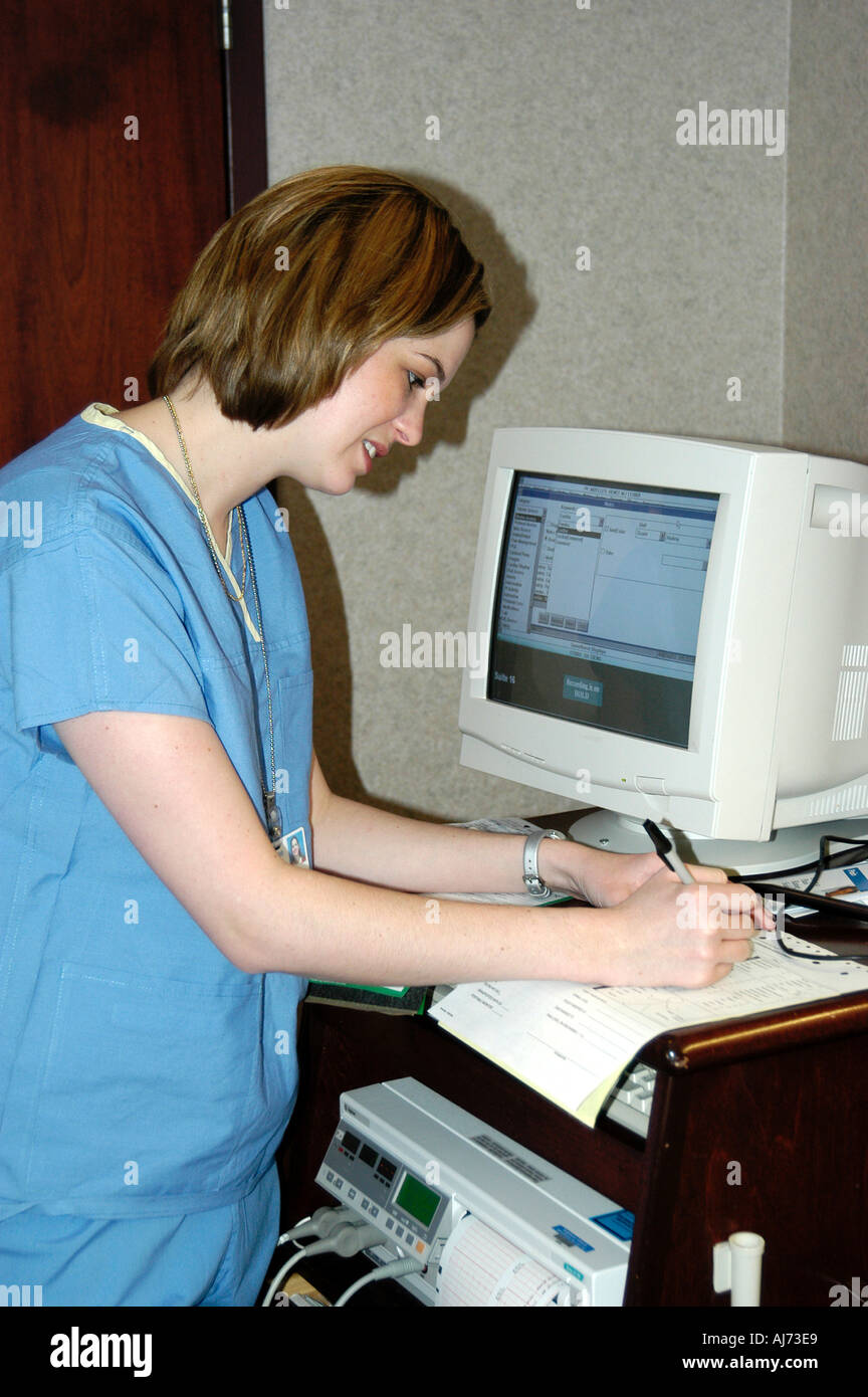 Female Hospital Technician At Work With Computer Stock Photo - Alamy