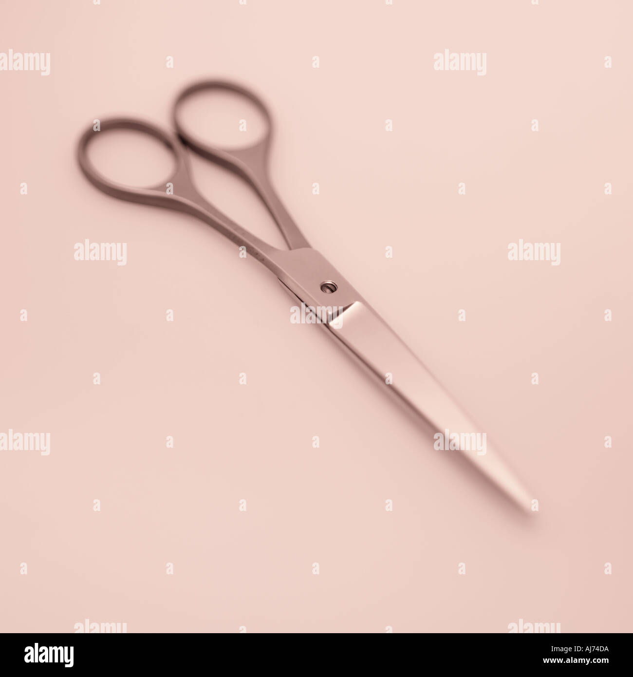 Scissors on plain background Stock Photo - Alamy