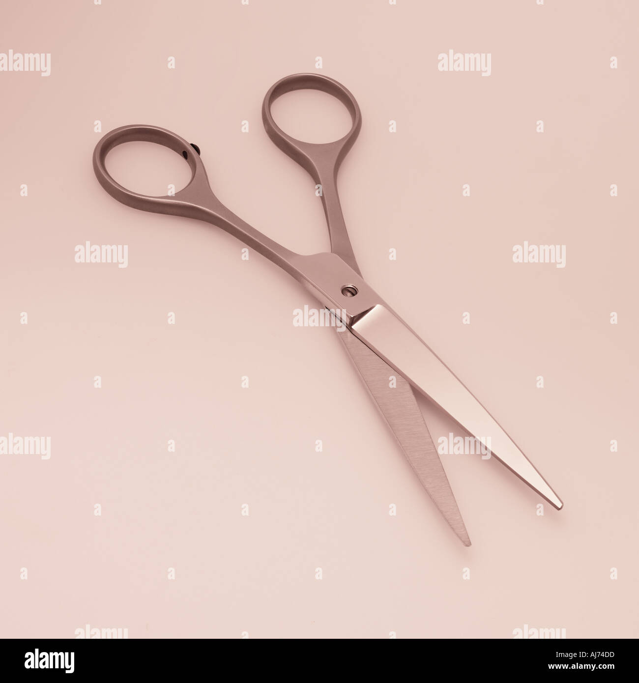 Scissors on plain background Stock Photo - Alamy