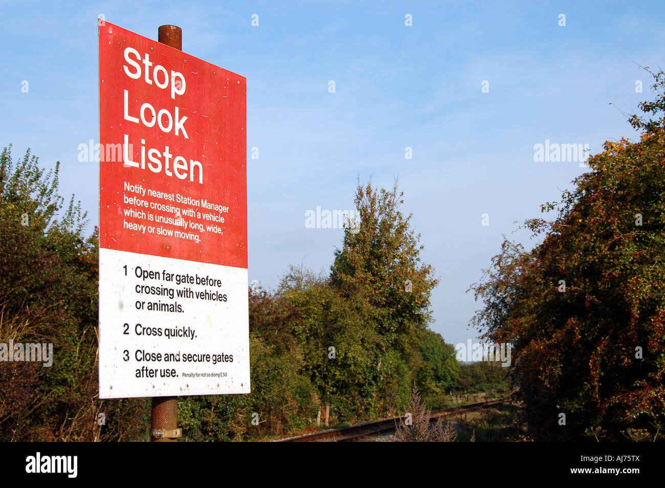 Sign at unmanned rail crossing, Bucks, UK Stock Photo - Alamy