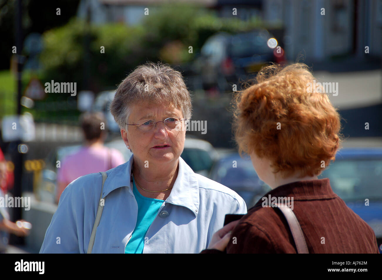 Speaking two women hi-res stock photography and images - Alamy