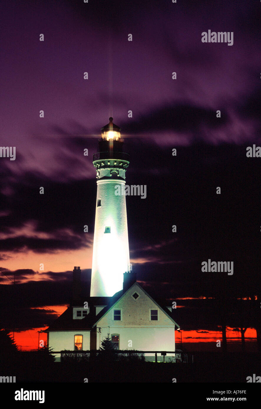 Another night is over as a purple dawn greets the Wind Point Lighthouse ...