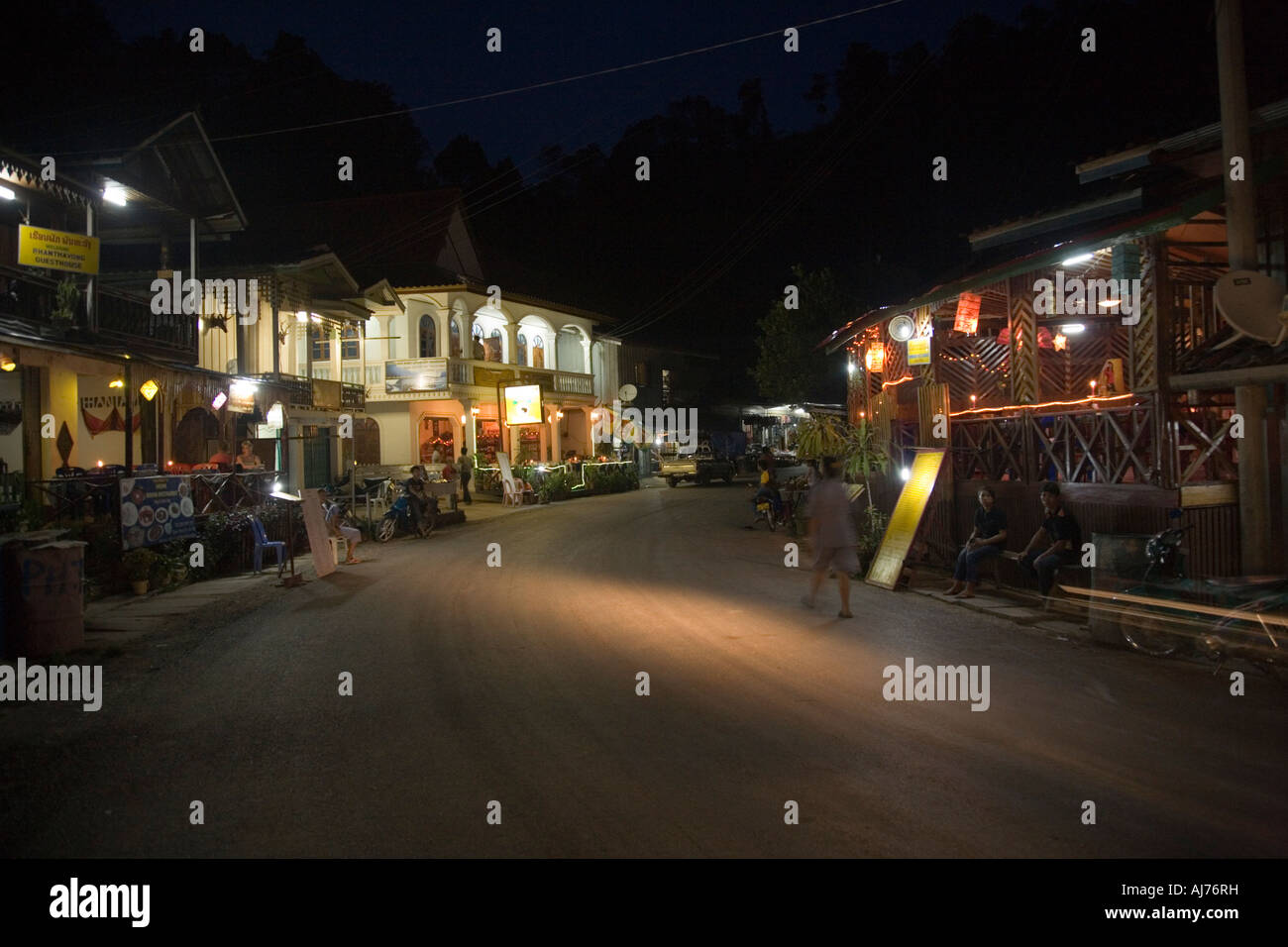 The main road after dark of Pakbeng on the Mekong river in Northern ...