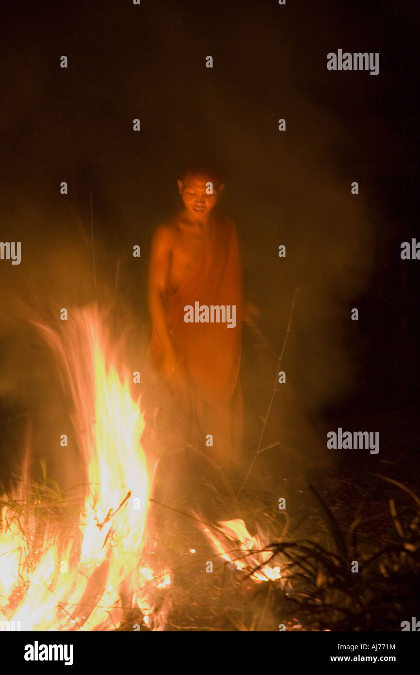 Novice monk by fire hi-res stock photography and images - Alamy