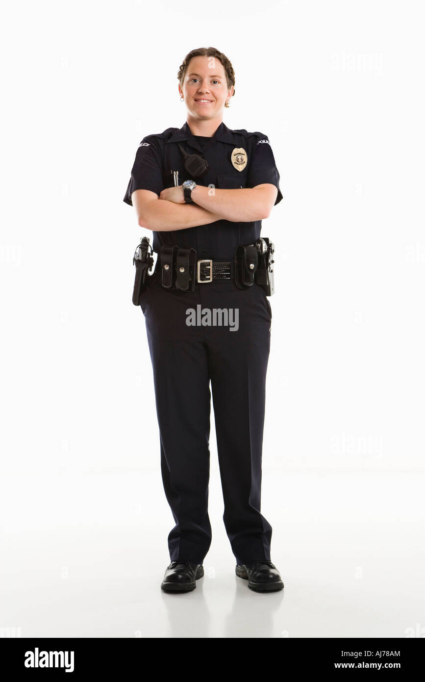 Portrait of mid adult Caucasian female law enforcement officer standing ...