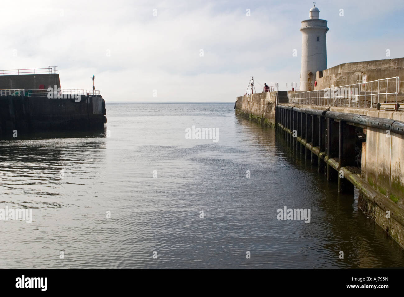 Buckie Harbour and the llighthouse, Moray, Scotland from a boat sailing ...