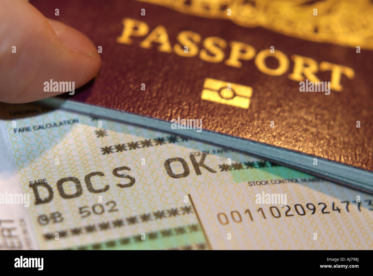 Biometric passport and DOCS OK boarding pass Stock Photo - Alamy