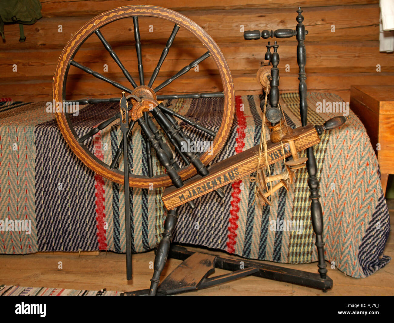 old spinning wheel in an block cabin Stock Photo - Alamy