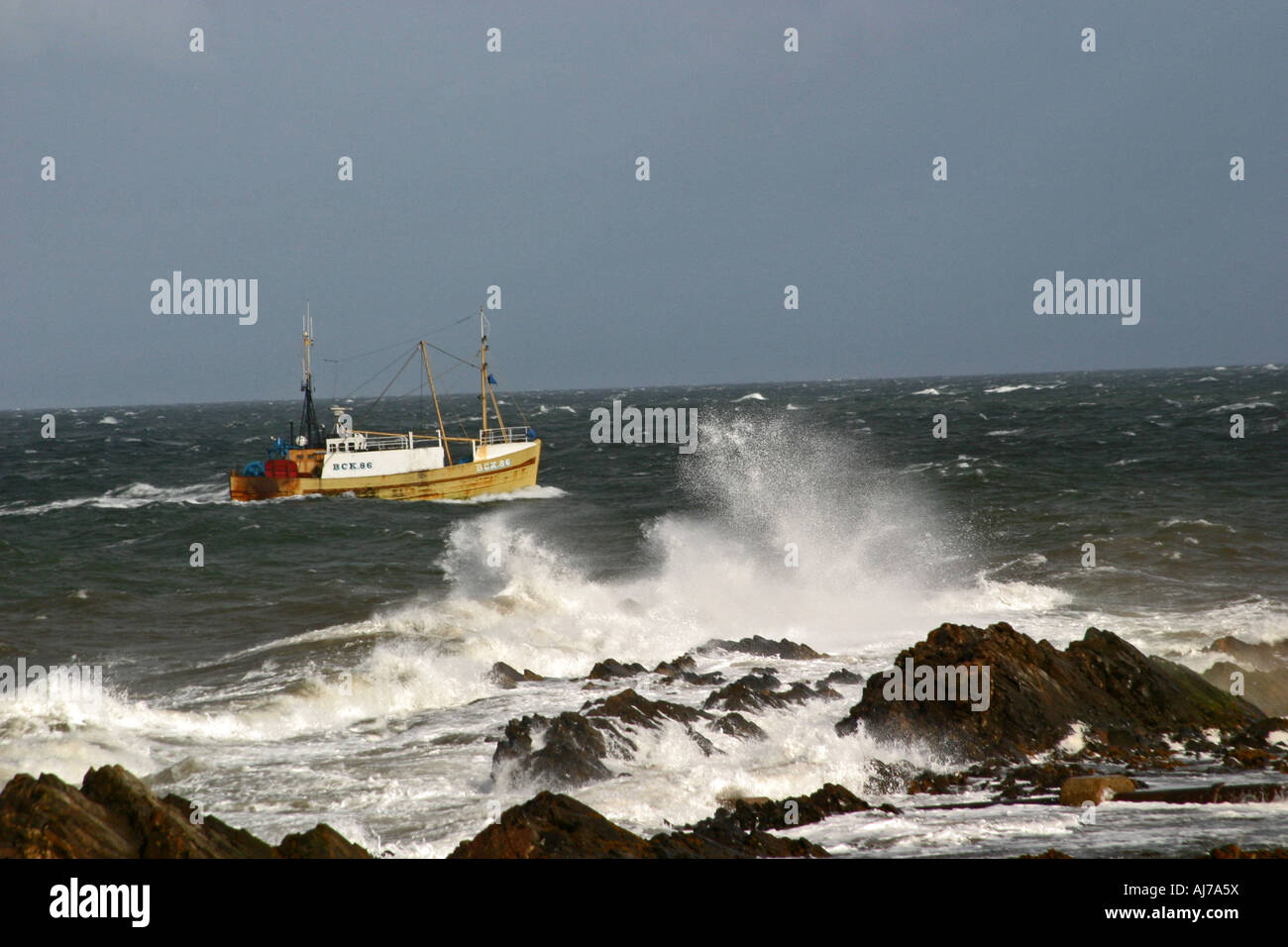 Fishing boat in the waves during a North Sea gale on the Moray Firth ...