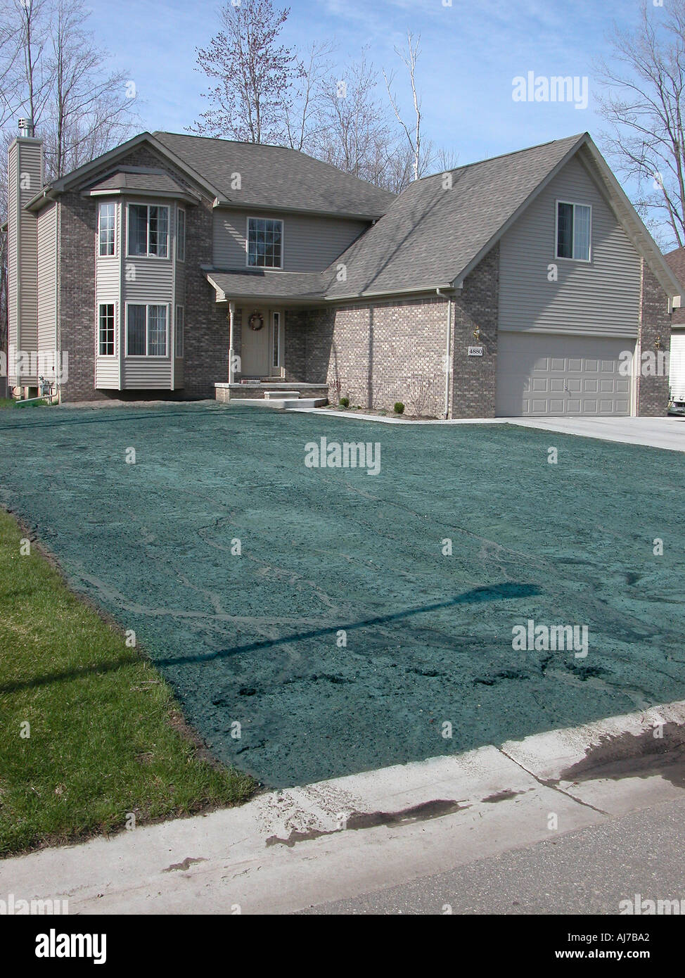 Residential Home Gets New Lawn by Hydro seeding Stock Photo - Alamy
