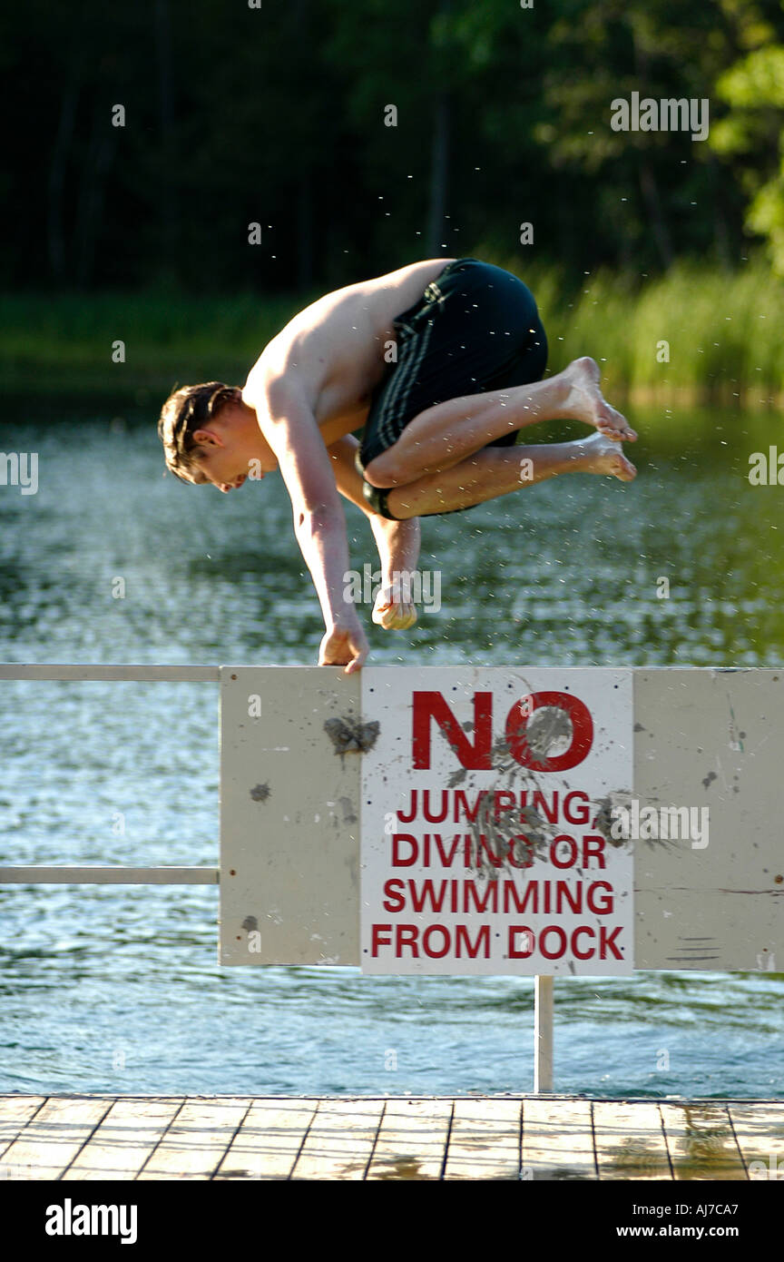 Teens Show Off at Swimming Pool Stock Photo - Alamy